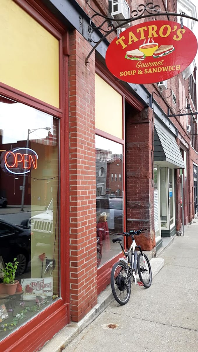 A welcoming red sign beckons sandwich lovers into this brick-fronted gem, where comfort meets craftsmanship in downtown St. Albans.