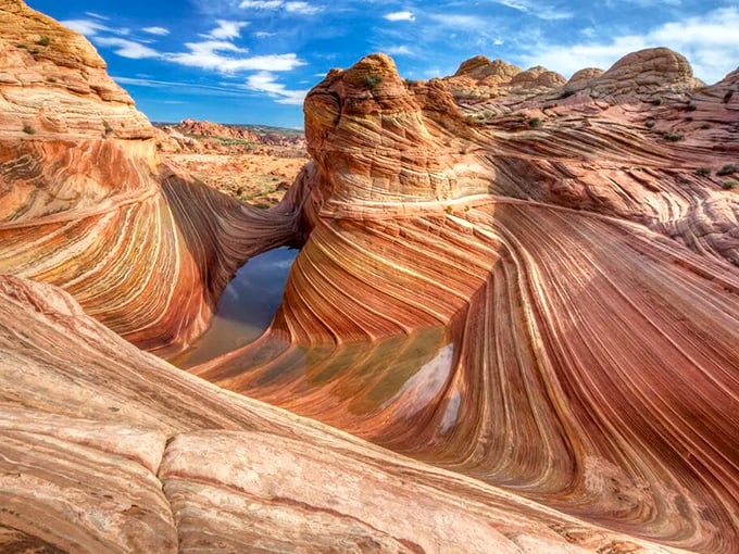 Nature's watercolor: The Wave formation at Vermilion Cliffs creates swirling sandstone patterns that would make Georgia O'Keeffe jealous. 