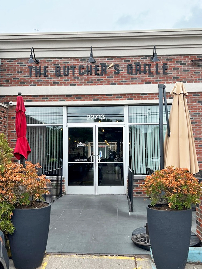 The Butcher's Grille's brick facade and welcoming entrance sets the stage for culinary adventures, with modern touches meeting traditional charm.