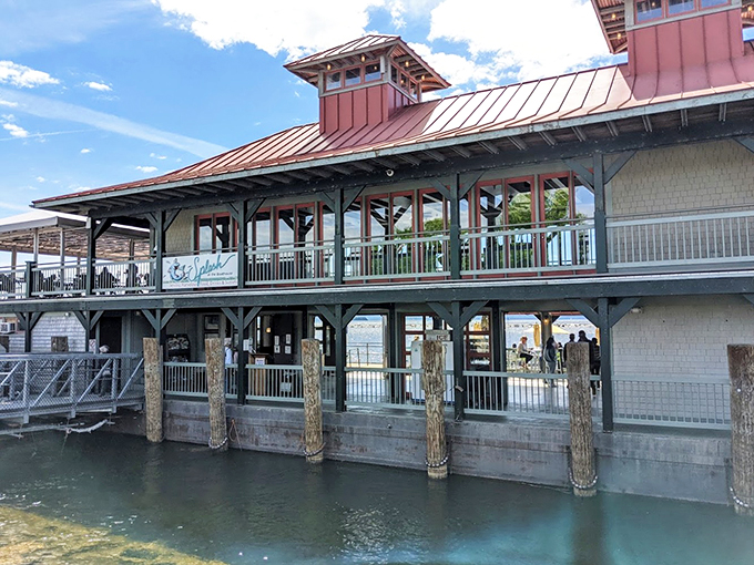 A classic New England boathouse transformed into a waterfront dining paradise, complete with copper-topped roof and Lake Champlain views.