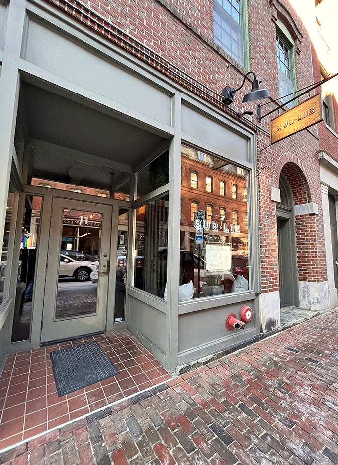 A charming brick storefront in Portland's Old Port beckons with understated elegance, like a secret dining club waiting to be discovered.