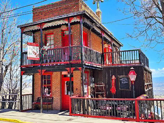 Step right up to the House of Joy, where history and whimsy collide! This brick beauty with its cherry-red trim is like a Victorian lady who's had one too many sarsaparillas.
