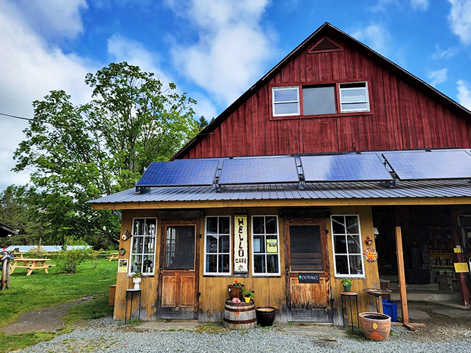 A classic Vermont red barn meets modern sustainability, with solar panels catching rays while scones catch hearts inside.