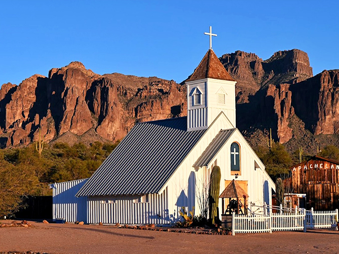Like a scene from a Western movie set, the pristine white Elvis Memorial Chapel stands guard against the dramatic backdrop of Arizona's Superstition Mountains.