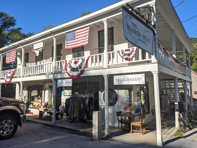 The Warren Store stands proudly in its white clapboard glory, decked out in American flags and patriotic bunting like Vermont's most charming general store.