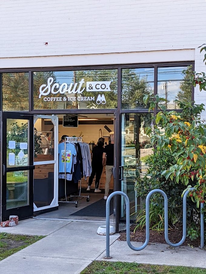 Scout & Co.'s welcoming storefront beckons with the promise of artisanal coffee and homemade ice cream, while bike racks invite eco-conscious visitors.