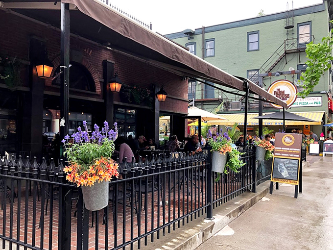 A charming brick facade with flower boxes that could make Martha Stewart jealous. The outdoor seating area beckons like a front-row ticket to Burlington's best show.