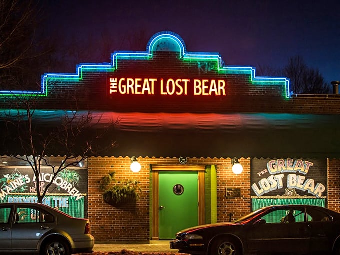 The neon-lit facade of The Great Lost Bear glows like a beacon in Portland's night, beckoning hungry souls with its emerald door and retro charm.