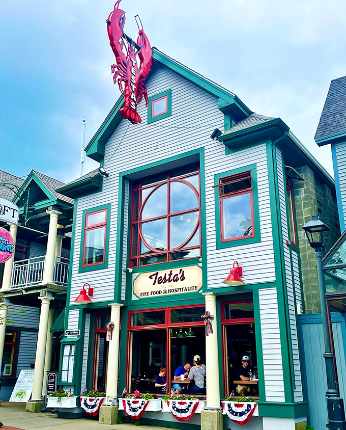 A charming white clapboard building crowned with a giant red lobster - Testa's stands like a delicious lighthouse beckoning seafood lovers home.