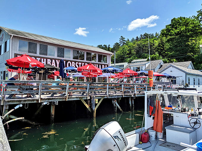 Welcome to lobster paradise! Boothbay Lobster Wharf beckons with its weathered charm and promise of oceanic delights. Those red umbrellas? They're not just for show – they're beacons of buttery bliss.