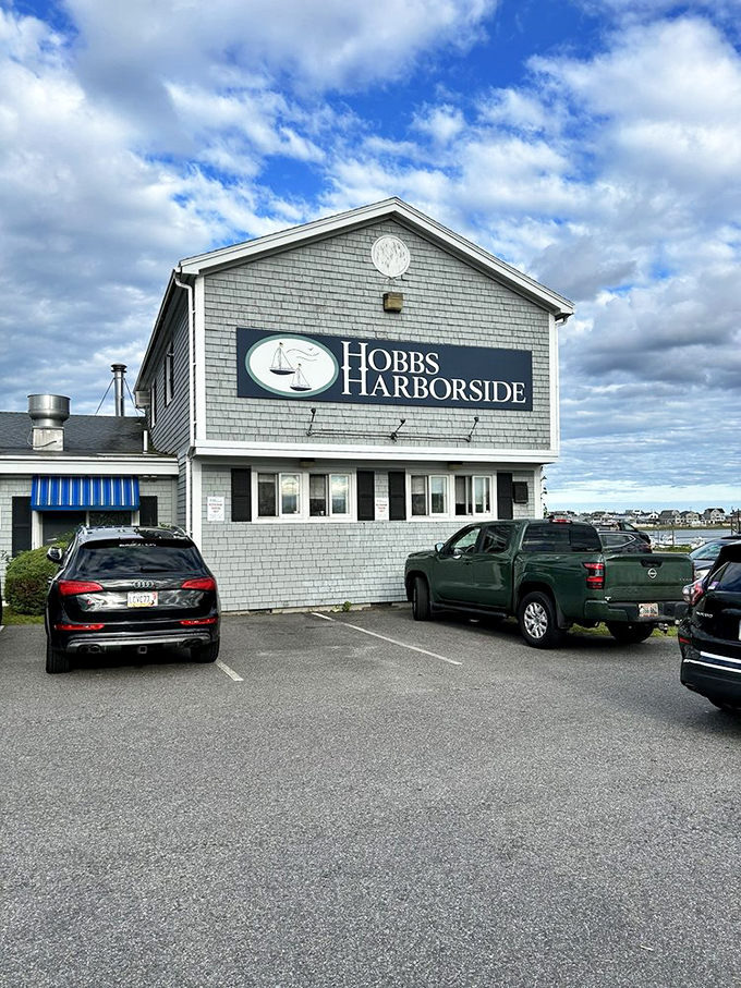 The gray-shingled beacon of seafood salvation stands proud against Maine's moody sky, beckoning hungry souls with its promise of maritime delights.