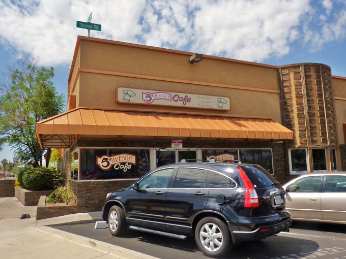 A welcoming tan building with an orange awning beckons hungry visitors on Thomas Road. The classic diner signage promises comfort food ahead. Photo credit: Chris English