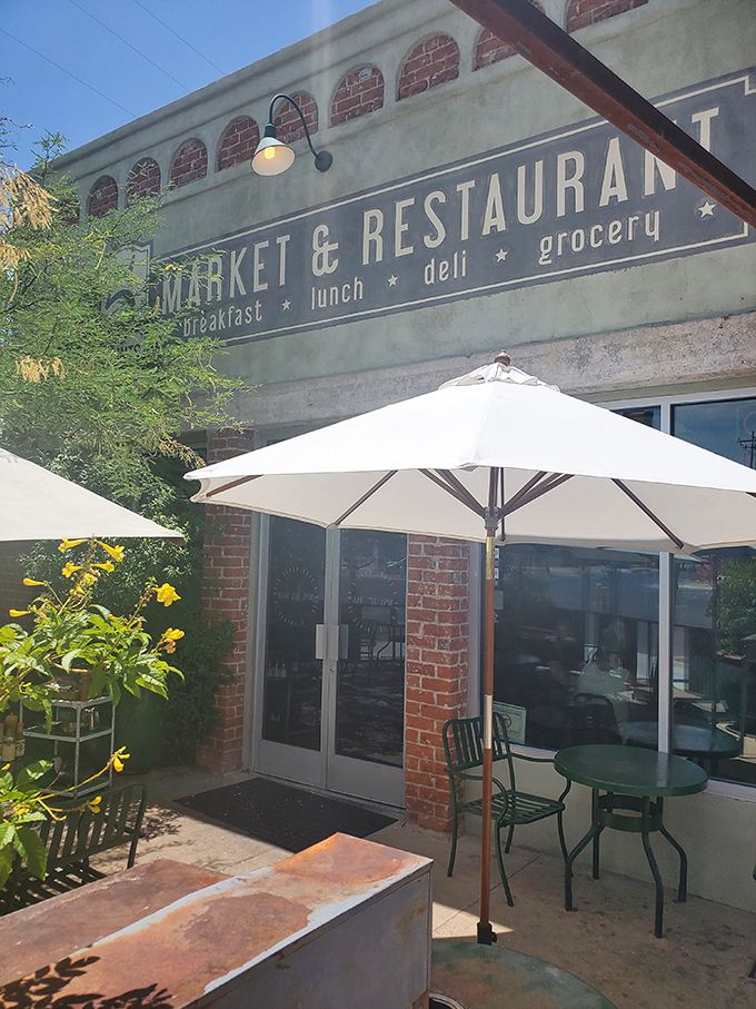A brick facade with vintage charm, white umbrellas, and yellow flowers create the perfect desert oasis for your morning feast. Photo credit: John and Tracy Smith