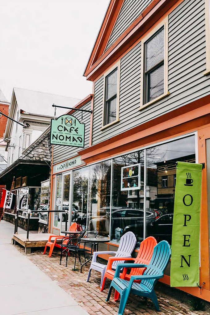 Welcome to Cafe Nomad, where Maine charm meets hipster cool! This colorful facade is like a warm hug for your eyes and a promise of deliciousness to come.