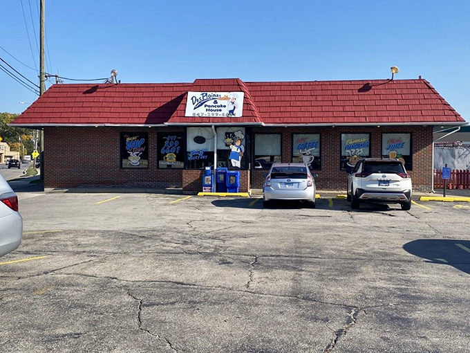 A classic red-roofed diner stands ready for breakfast, its brick facade and vintage signage promising comfort food that feels like a warm hug.