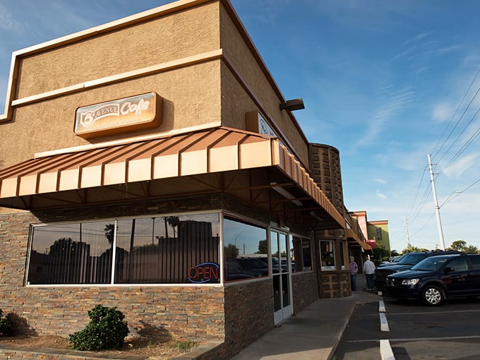 The tan exterior and copper awning may look unassuming, but inside this Phoenix gem, culinary jazz magic awaits every hungry visitor. Photo credit: 5th Avenue Cafe Phoenix, AZ