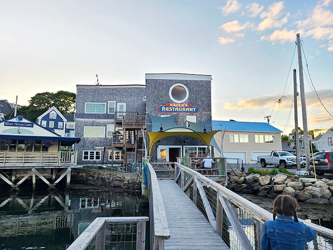 A postcard-perfect Maine restaurant perched over the water, complete with a wooden walkway that practically whispers "fresh seafood ahead."