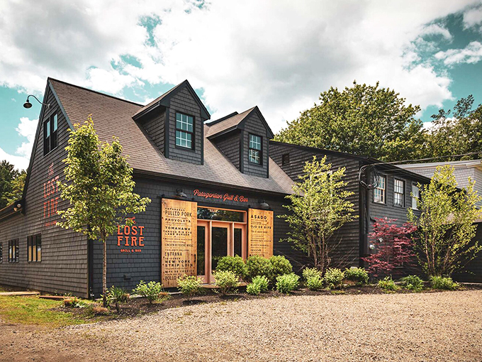 A charming New England coastal gem, The Lost Fire's dark-shingled exterior and wooden menu boards hint at the culinary treasures within. Photo credit: The Lost Fire