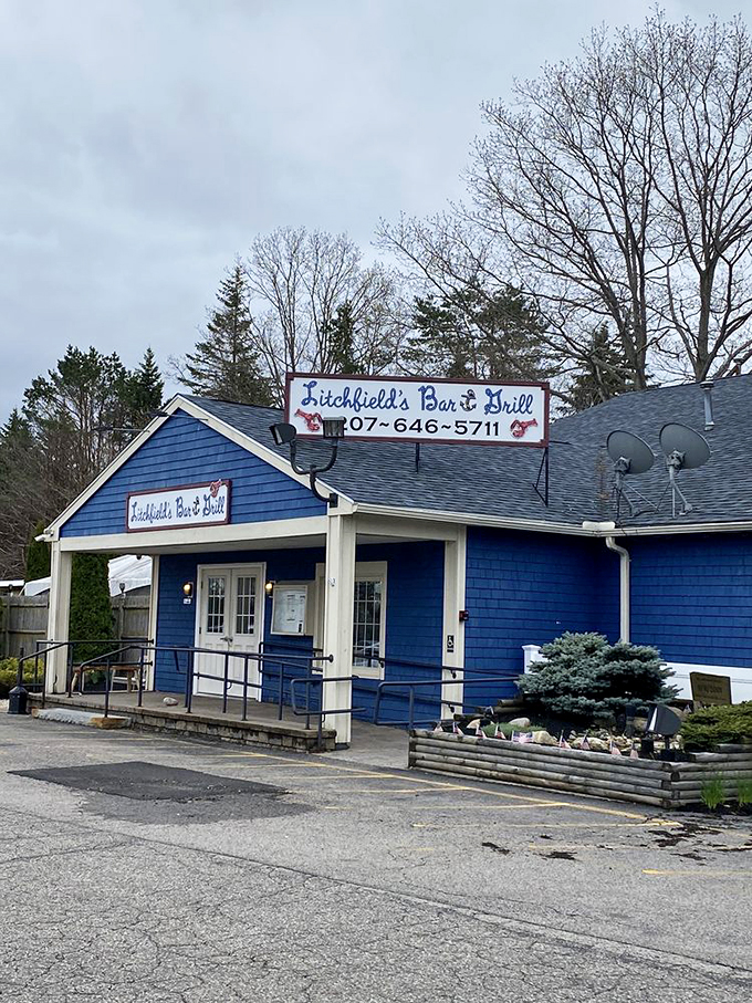 A cheerful blue beacon of seafood salvation, Litchfield's Bar & Grill welcomes hungry visitors with classic New England charm and hospitality. Photo credit: Kelly S.