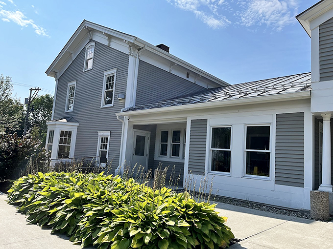This stately Greek Revival mansion from the 1850s proves that even fast food can have a sophisticated address. The hostas add a perfect New England touch. Photo credit: Sandra Hoffmann