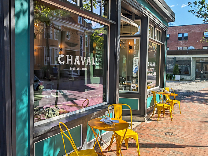 Chaval's storefront: Where Spanish flair meets Maine charm. Those yellow chairs are practically shouting, "Siesta? No way, it's fiesta time!"
