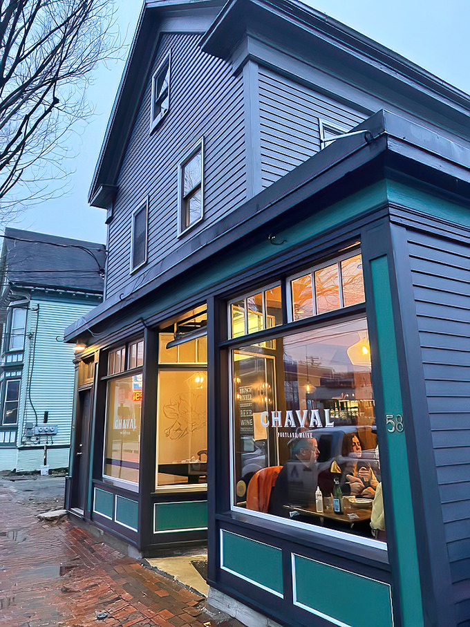 Chaval's storefront: Where Spanish flair meets Maine charm. Those yellow chairs are practically shouting, "Siesta? No way, it's fiesta time!"