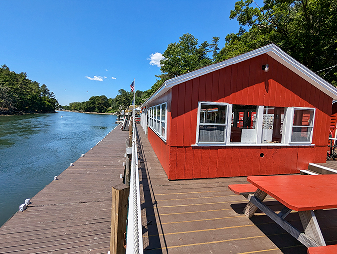 A seafood lover's dream come true! This charming red lobster shack perched on the water's edge is like a postcard come to life.