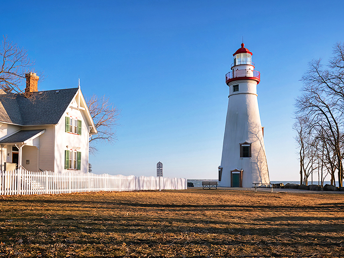 A postcard come to life! The Marblehead Lighthouse stands tall, its white tower a beacon of hope against the azure sky.