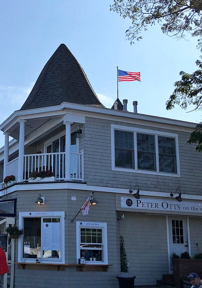 A postcard-perfect New England scene: Peter Ott's white-trimmed facade and twin turrets stand proudly against Maine's blue skies, welcoming hungry visitors.