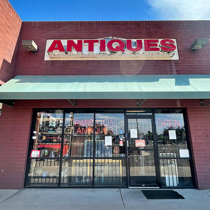 Antiques blazes in red, a siren call to treasure hunters. This unassuming storefront hides a labyrinth of wonders waiting to be discovered.