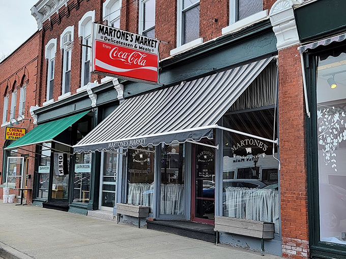 A slice of Americana, served with a side of charm! Martone's Market & Café beckons with its classic red Coca-Cola sign and striped awnings, promising a taste of nostalgia.