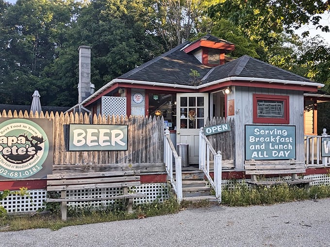 A charming Vermont cottage turned breakfast paradise, complete with picket fence signs promising beer, wine, and pancakes bigger than your dreams.