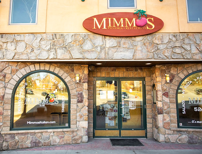 Welcome to Mimmo's, where the stone facade whispers "Tuscan village," but the aroma screams "pizza paradise!" Step inside and prepare for a culinary adventure.