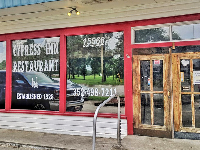 A slice of old Florida charm since 1928, the Cypress Inn's red-trimmed facade and weathered wooden doors welcome hungry travelers.