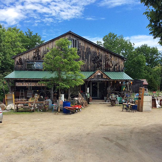 Like a time capsule wrapped in weathered wood, Elmer's Barn stands proud against the Maine sky, inviting treasure hunters to explore its wonders.