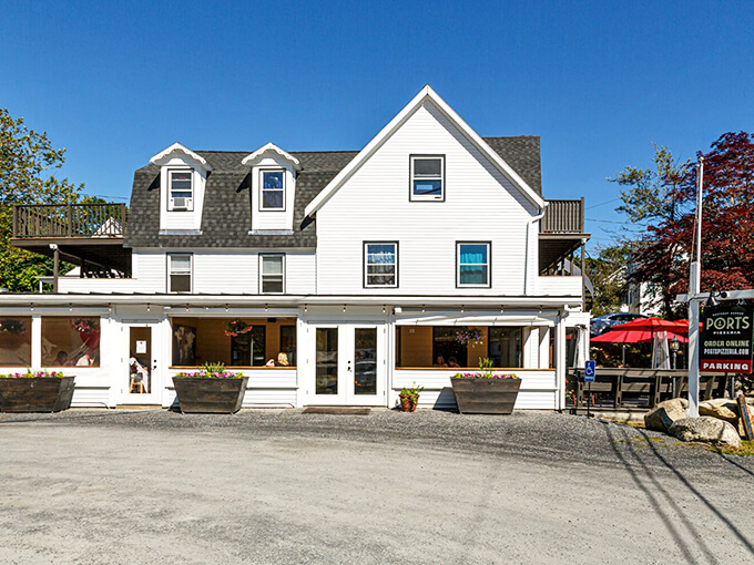 A classic New England coastal building transformed into pizza paradise, complete with flower boxes that would make Martha Stewart proud.