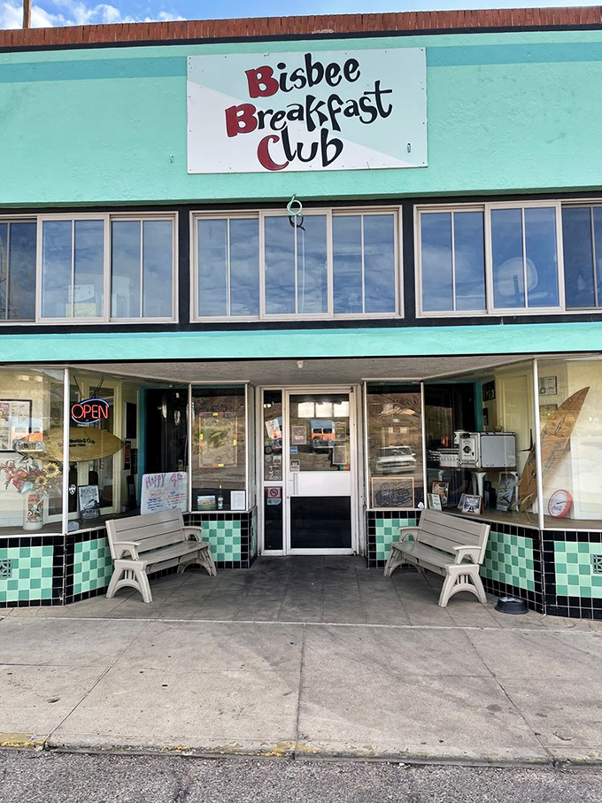 The mint-green facade and retro signage of Bisbee Breakfast Club welcomes visitors like a cheerful morning greeting in architectural form.