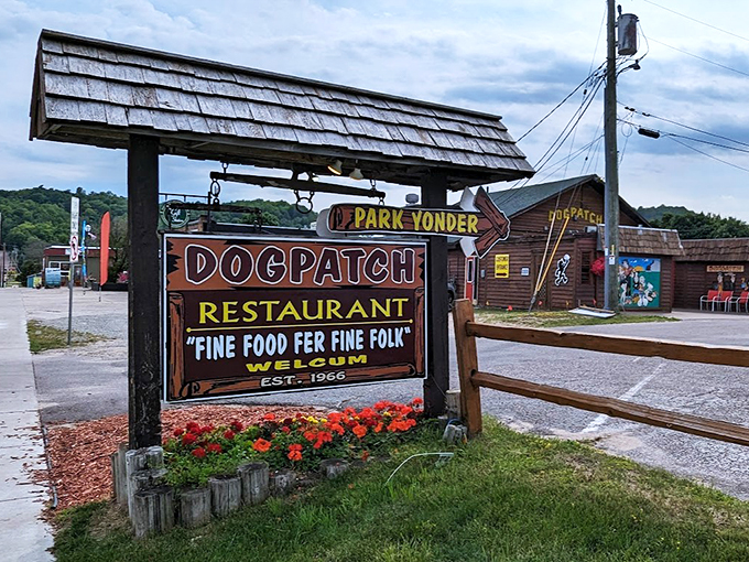 Where Li'l Abner meets Lake Superior charm&mdash;this rustic welcome sign promises "Fine Food Fer Fine Folk" and delivers on every word.