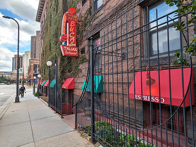 Mama mia! This brick facade isn't just a wall &ndash; it's a portal to pasta paradise. Red awnings and ivy whisper promises of cozy Italian feasts within.