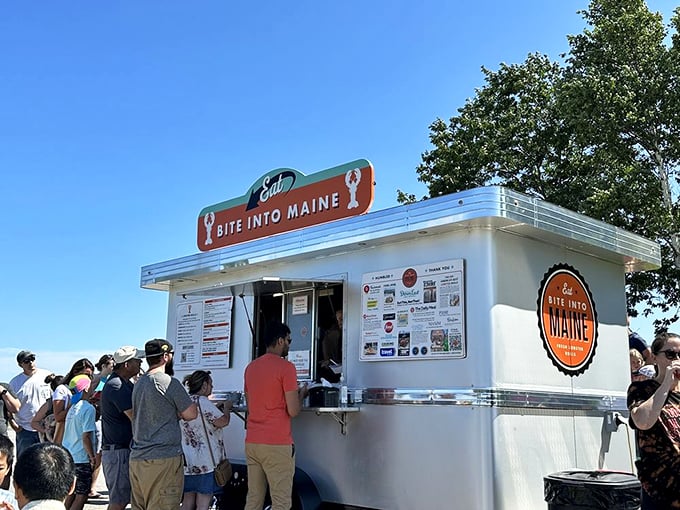 Like a retro diner that learned to roll, this gleaming white food truck serves up Maine's finest lobster rolls against a perfect summer sky. Photo credit: Mitali B.