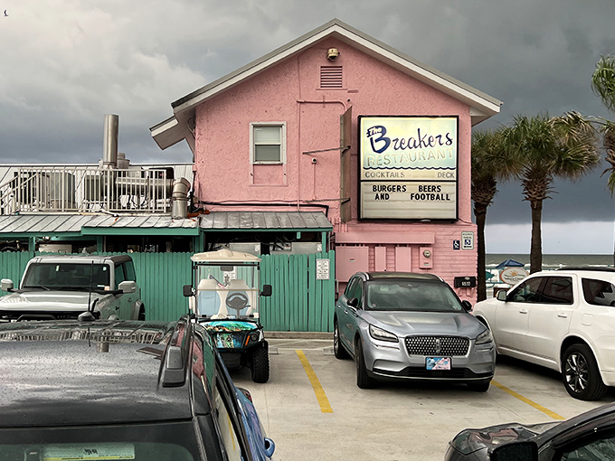 The iconic pink building of The Breakers stands proudly against Florida skies, a beacon for hungry beachgoers seeking refuge and really good fish.