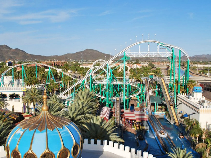 A desert oasis of thrills! Castles N' Coasters emerges like a mirage, its twisting tracks and whimsical domes promising adventure under the Arizona sun.