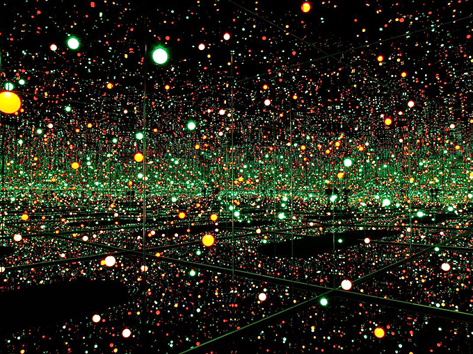 Like stepping into a galaxy made of Christmas lights, Kusama's Infinity Mirror Room creates an endless dance of colored fireflies.