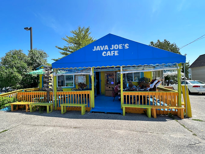 Welcome to the Technicolor dream cafe! Java Joe's exterior is like a Wes Anderson set come to life, promising whimsy with every sip and bite.