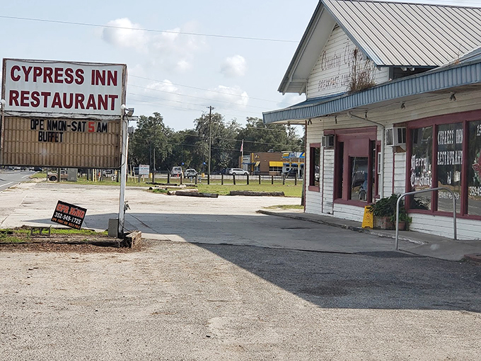 Welcome to the Cypress Inn, where time slows down and appetites rev up! This unassuming facade hides a treasure trove of Southern delights.