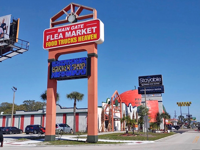 Welcome to the Technicolor dreamcoat of flea markets! This sign promises a paradise of bargains and bites that'll make your wallet and taste buds dance.