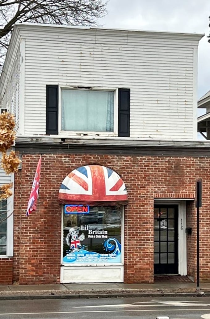 A slice of Britain on Main Street! This charming facade, complete with a Union Jack awning, promises a jolly good time and tasty treats inside.