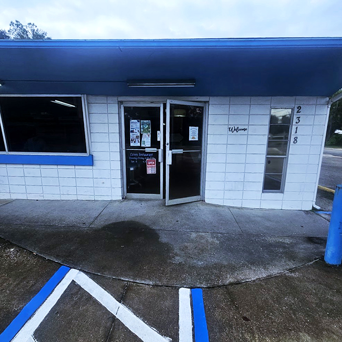 Welcome to Colee's, where the blue trim whispers "diner" but the food shouts "culinary adventure!" This unassuming facade hides a world of flavor.