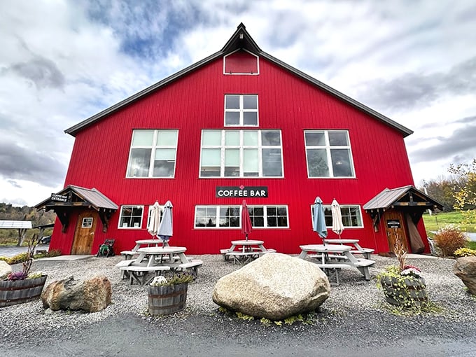 A barn-red beacon of caffeinated bliss! This coffee shop looks like it could double as Santa's summer home, complete with picnic tables for elves on break.