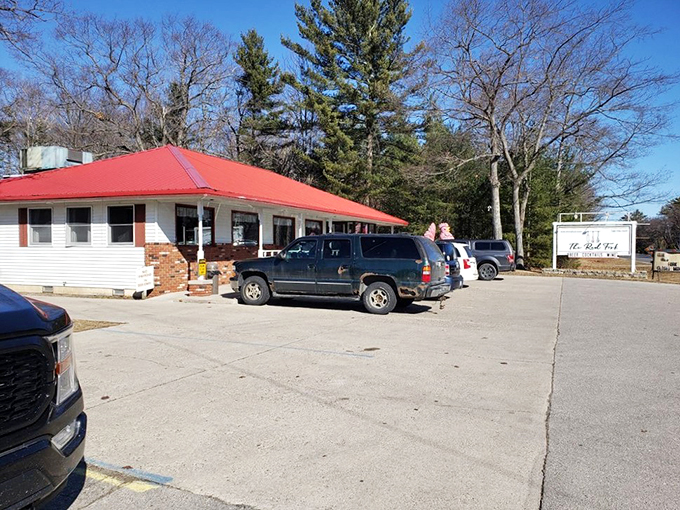 Welcome to burger paradise! The Red Fork's charming exterior promises a feast for the senses, with its iconic red roof beckoning hungry travelers like a culinary lighthouse.